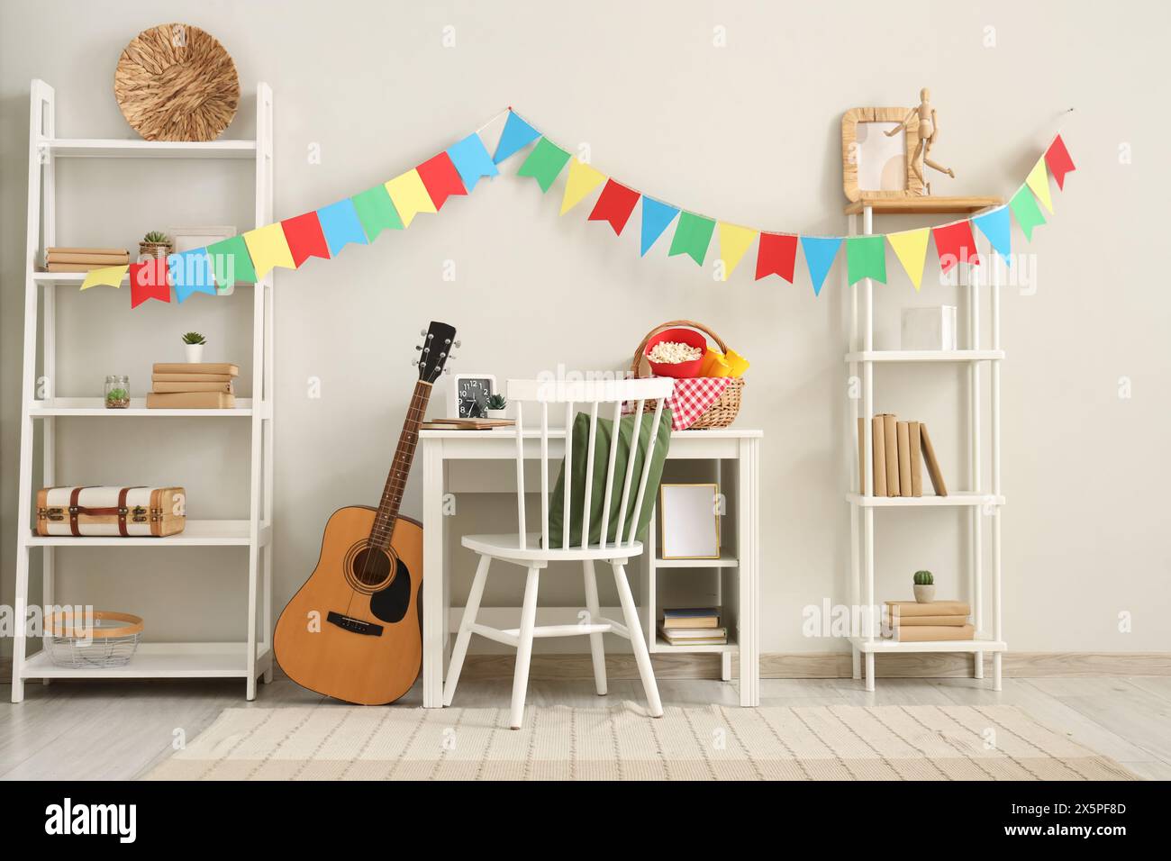 Interior of festive living room with white table and decorations for ...