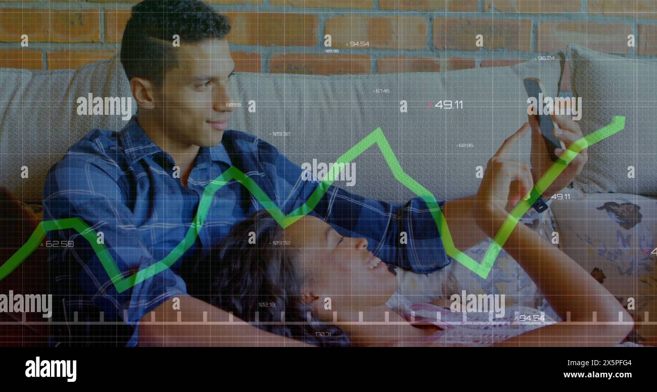 Image of graph and changing numbers, diverse couple watching images on ...