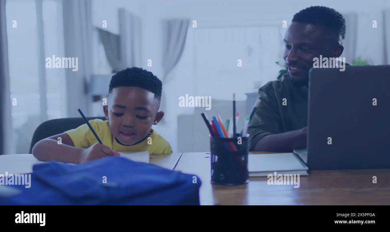 Father with short black hair and beard, watching son in blue shirt ...