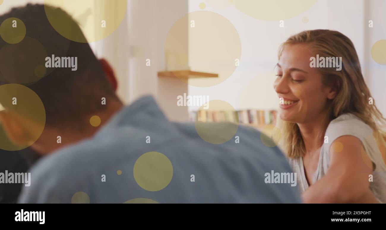 Image of dots moving over happy diverse friends having fun at home ...