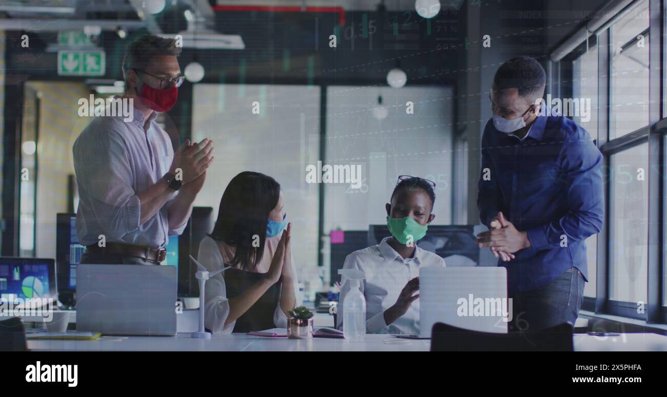 In this image, office colleagues are seen clapping together while ...