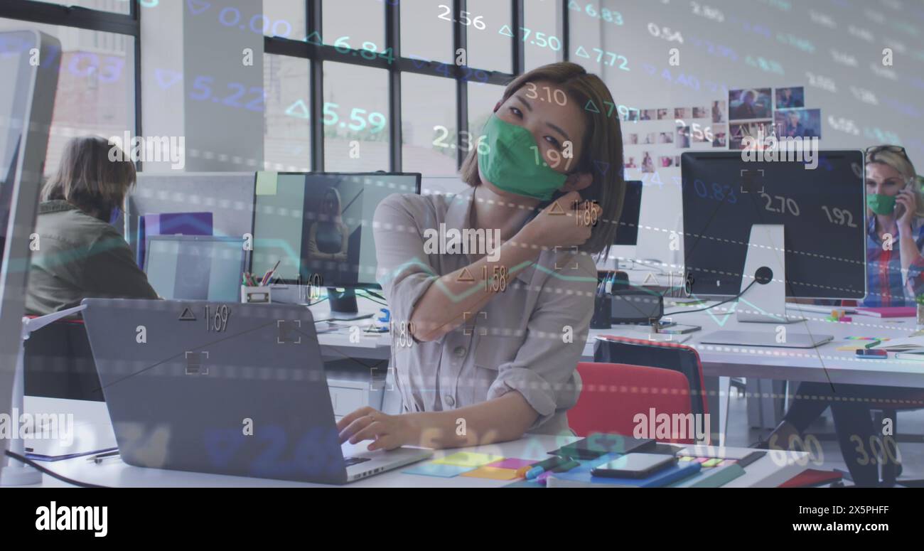 Image of changing numbers and heart rhythm over asian woman removing ...