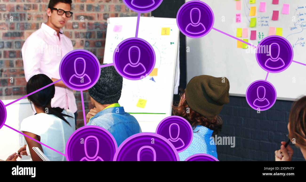 Image of connected icons over diverse manager explaining strategy to ...