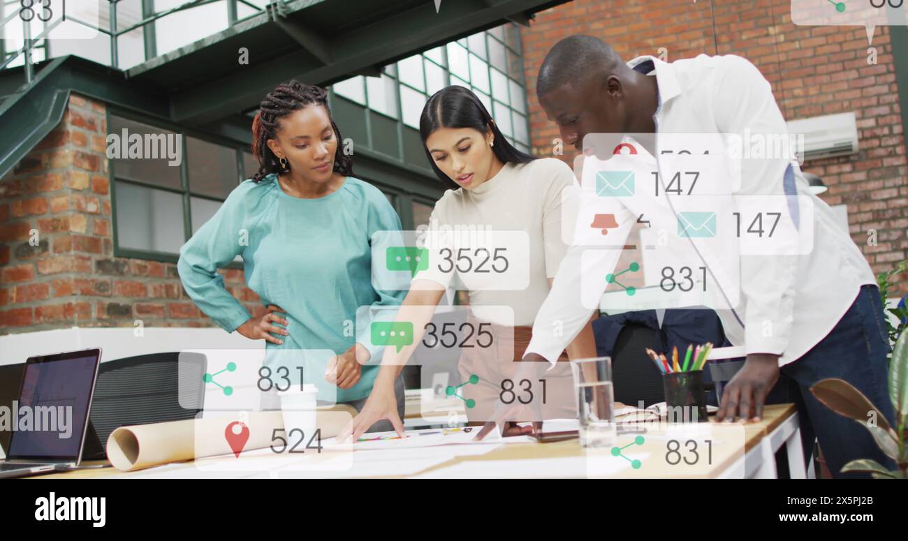 Anmation of social media icons floating over diverse colleagues ...