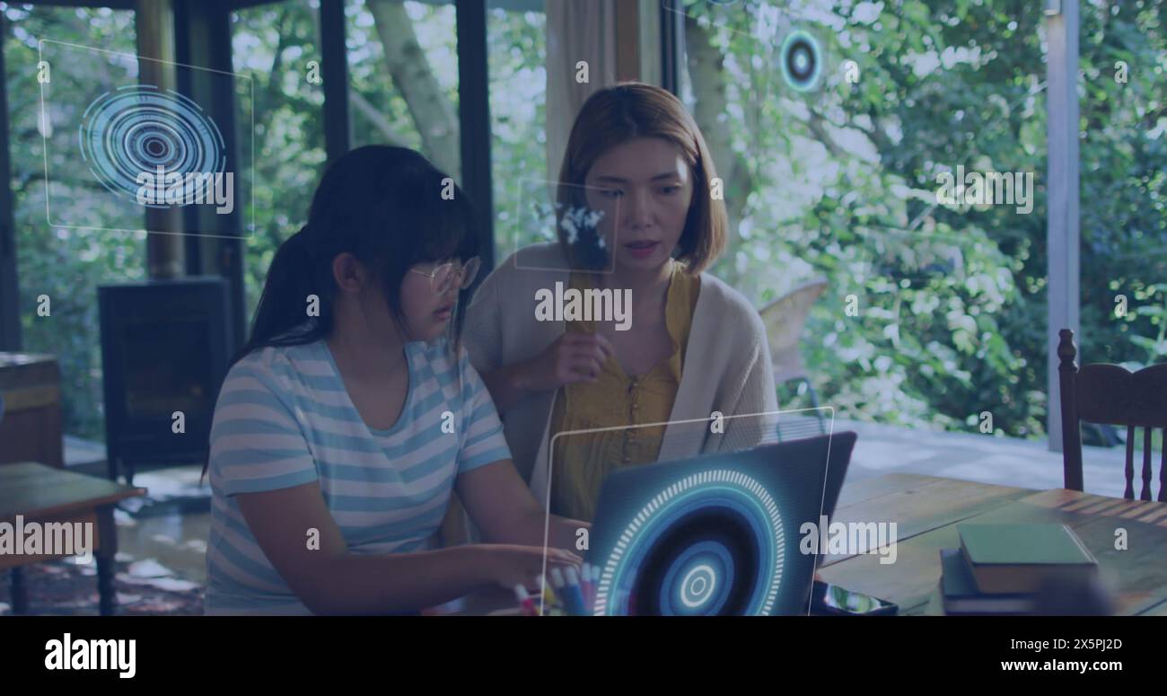 Image of data processing against asian mother and daughter using laptop ...