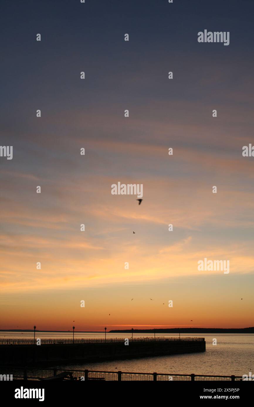 Early Morning Sunrise Over Looking the Water Stock Photo - Alamy