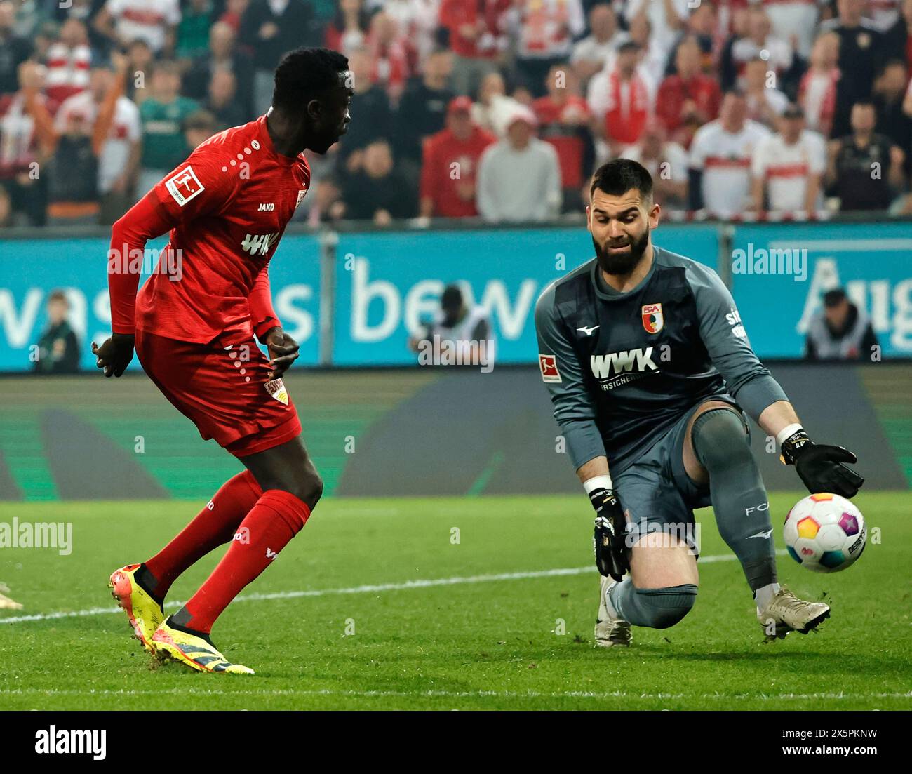 Augsburg, Germany. 10th May, 2024. Silas Katompa-Mvumpa (L) of ...
