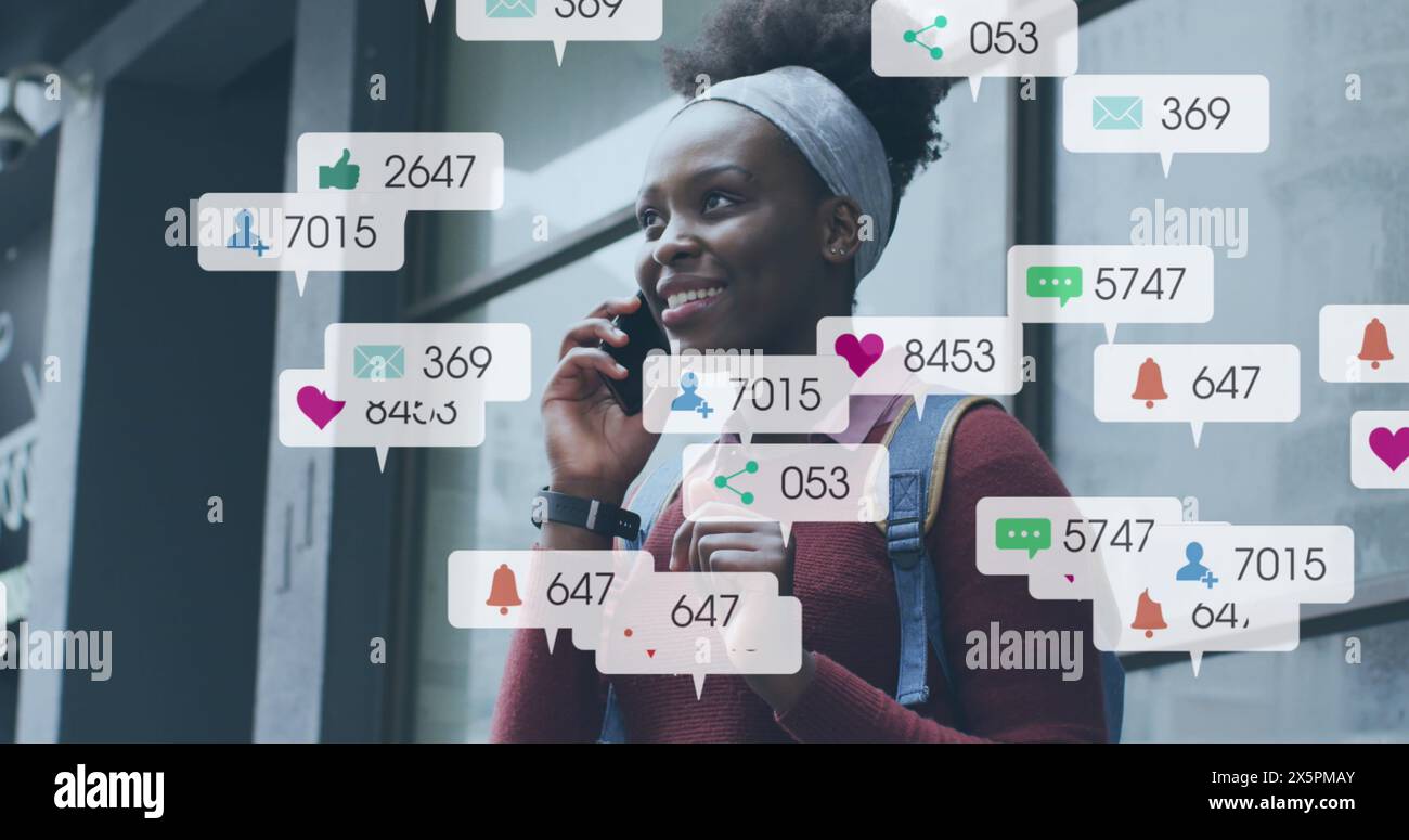 Image of social media icons and numbers over african american woman ...