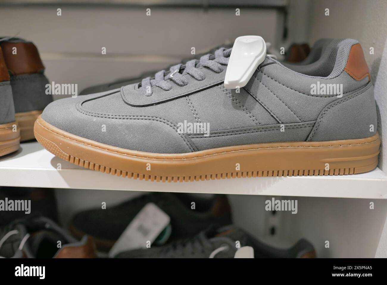 Security tags on clothes hi-res stock photography and images - Alamy