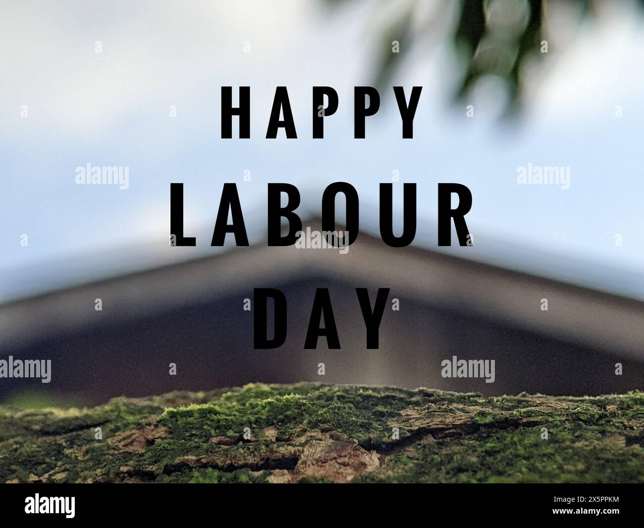 Text HAPPY LABOUR DAY with blurry house background Stock Photo - Alamy