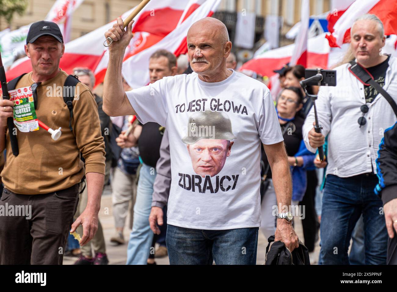 A protester is seen wearing a white T-shirt with the image of Tusk ...