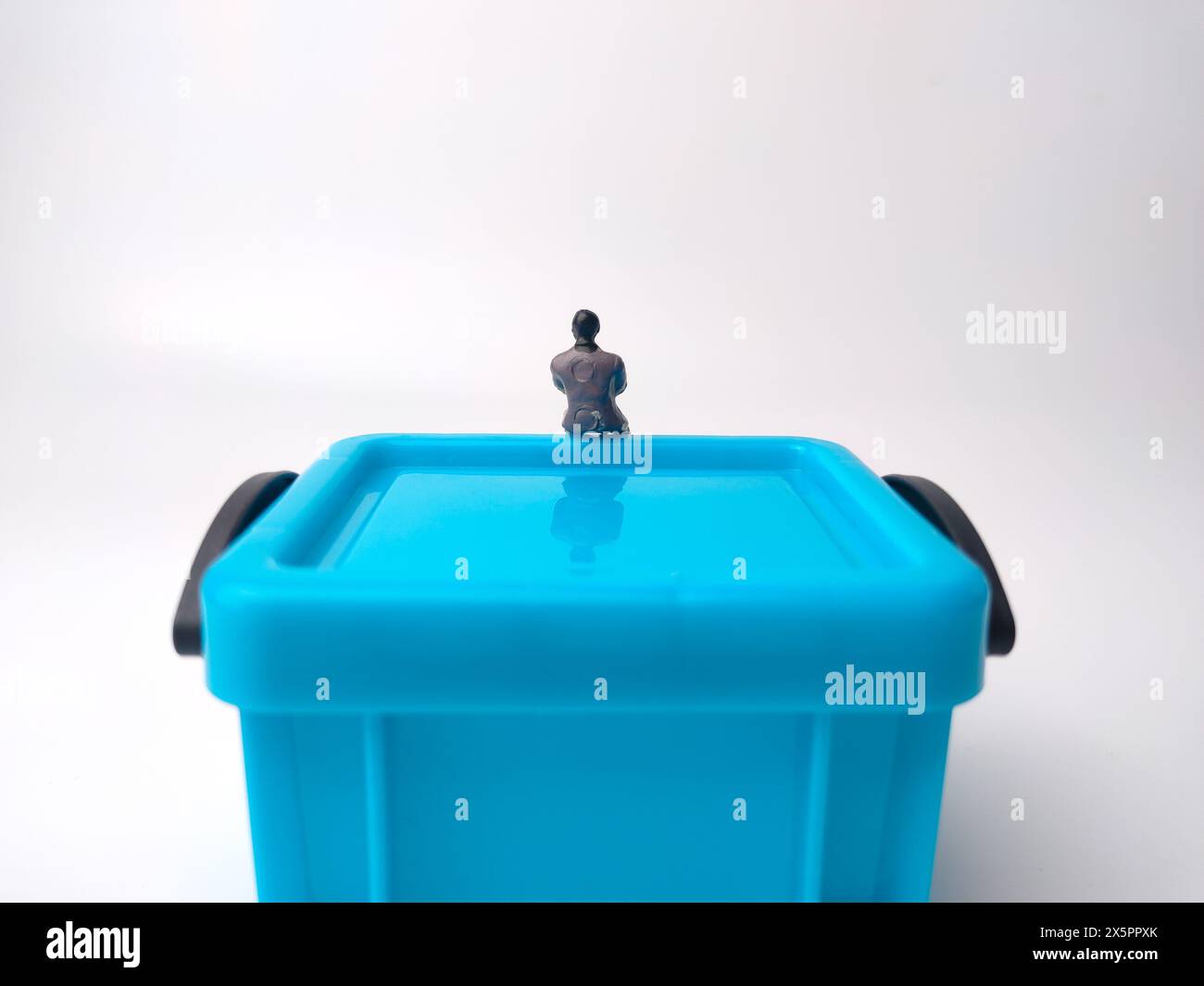Miniature person sitting in box hi-res stock photography and images - Alamy