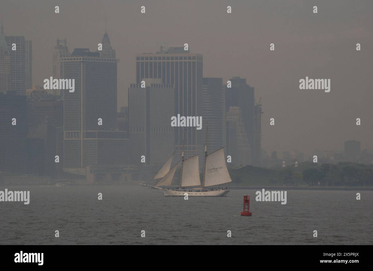 Clipper Ship tours in New York Harbor with the city skyline behind it ...