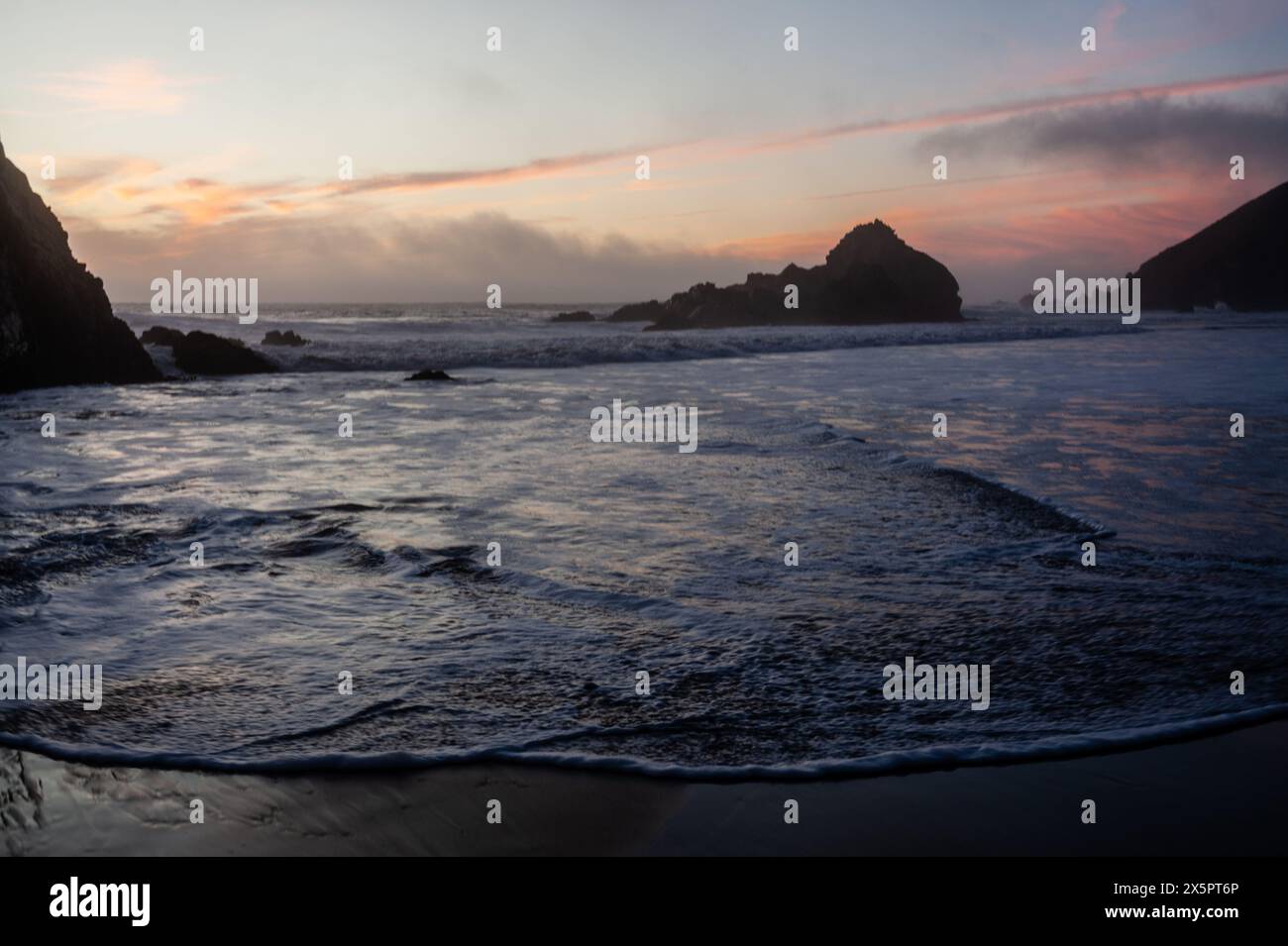 Water from the pacific ocean washing ashore on Pfeiffer beach, around ...