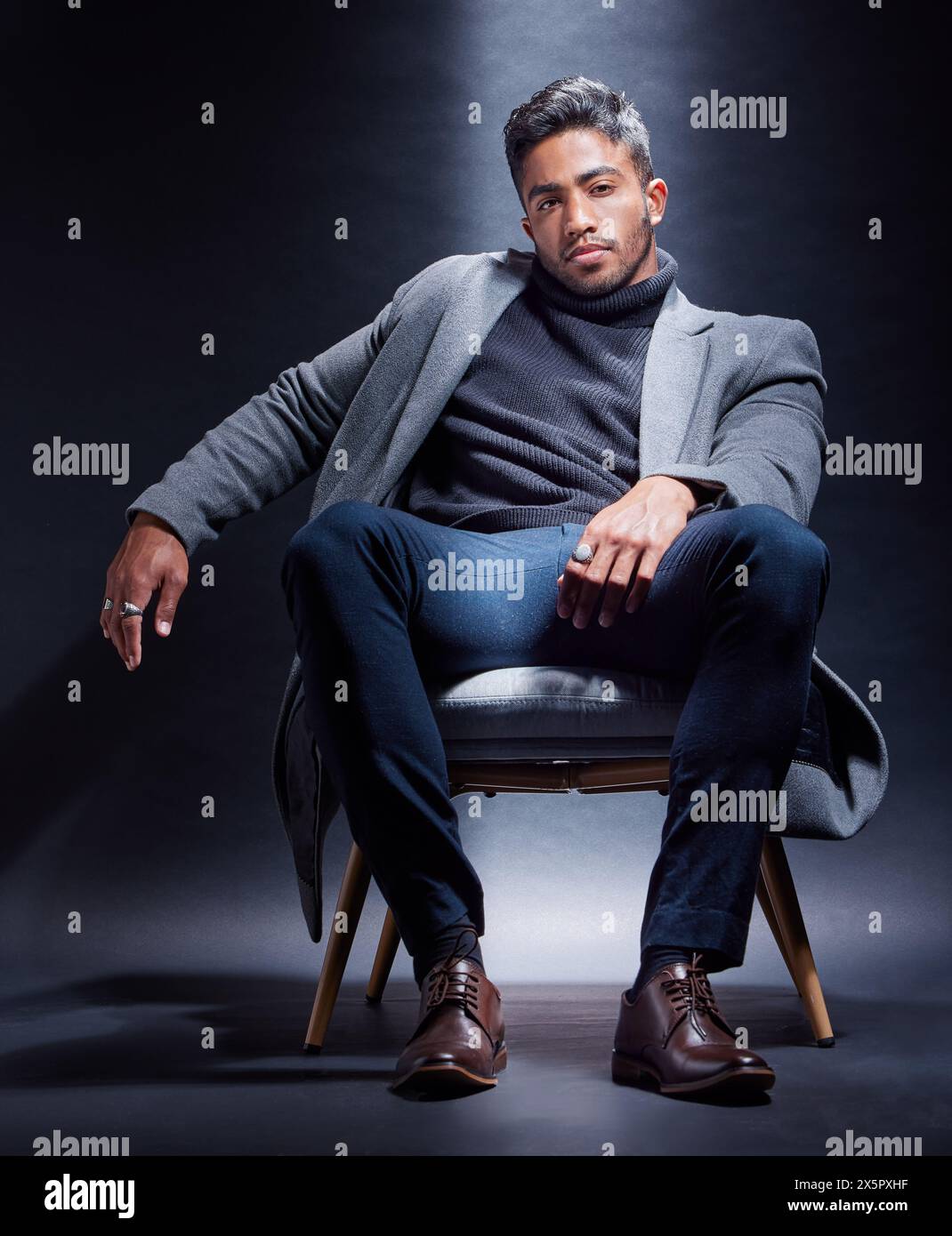 Mafia, portrait and man with fashion in chair on studio, dark ...