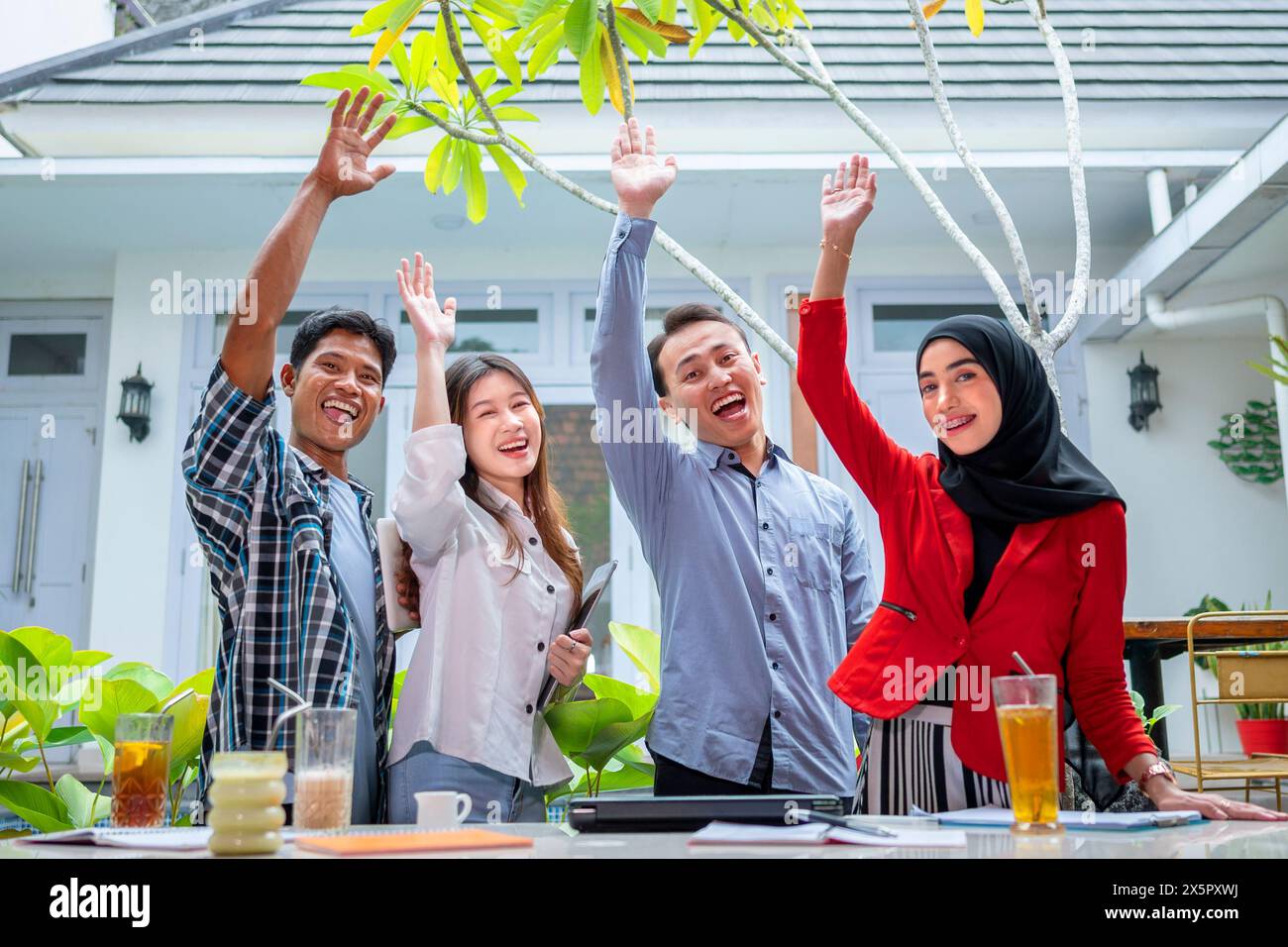 Indonesian business office teamwork for a startup company, smiling for ...