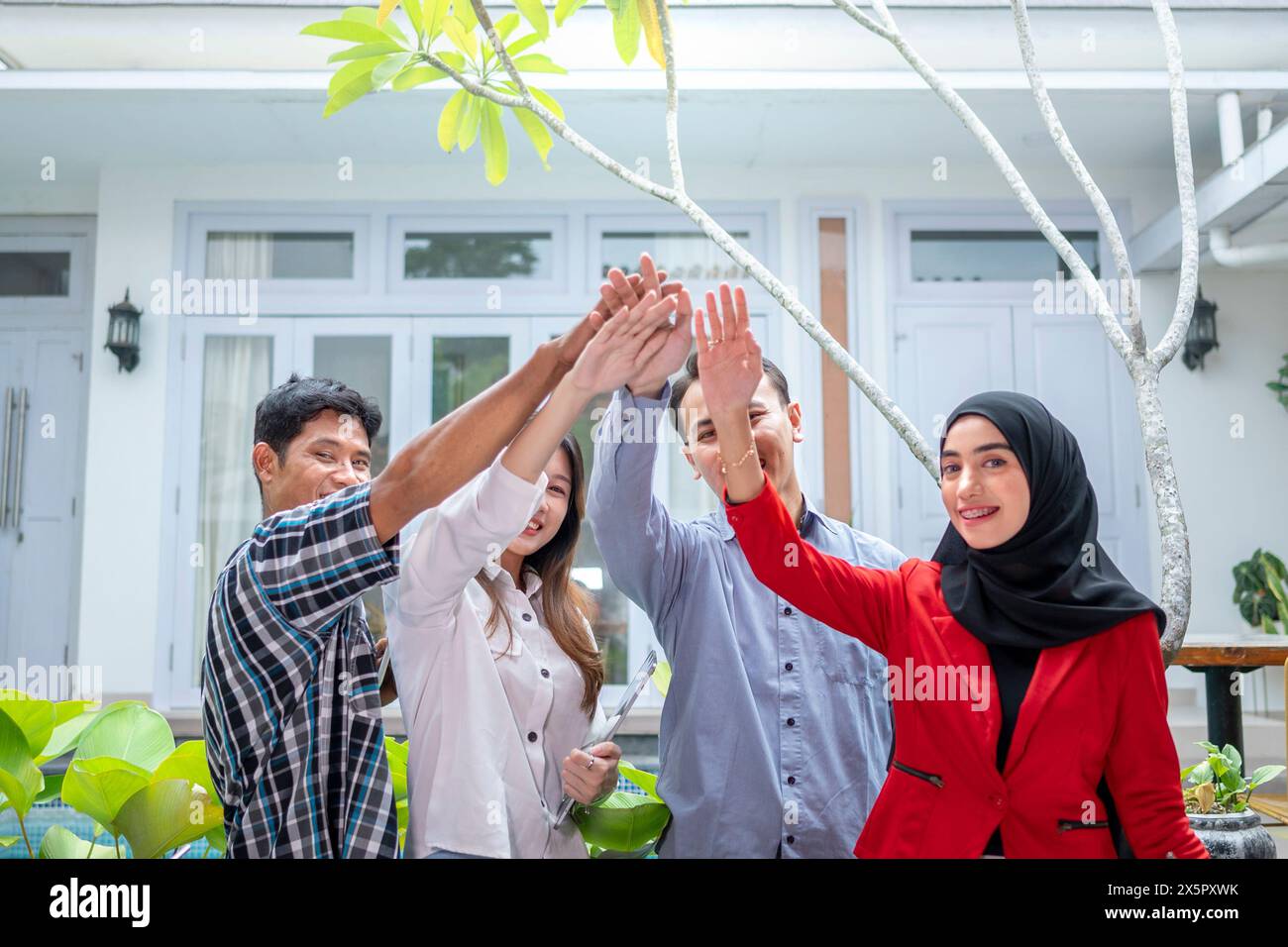 Indonesian business office teamwork for a startup company, smiling for ...