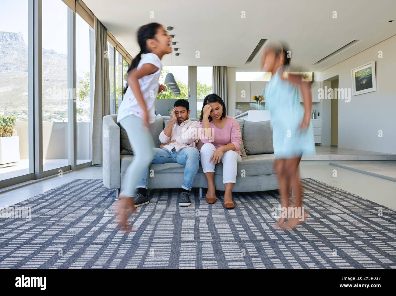 Parents, jump and stress in home, kids and tired with anxiety, burnout ...