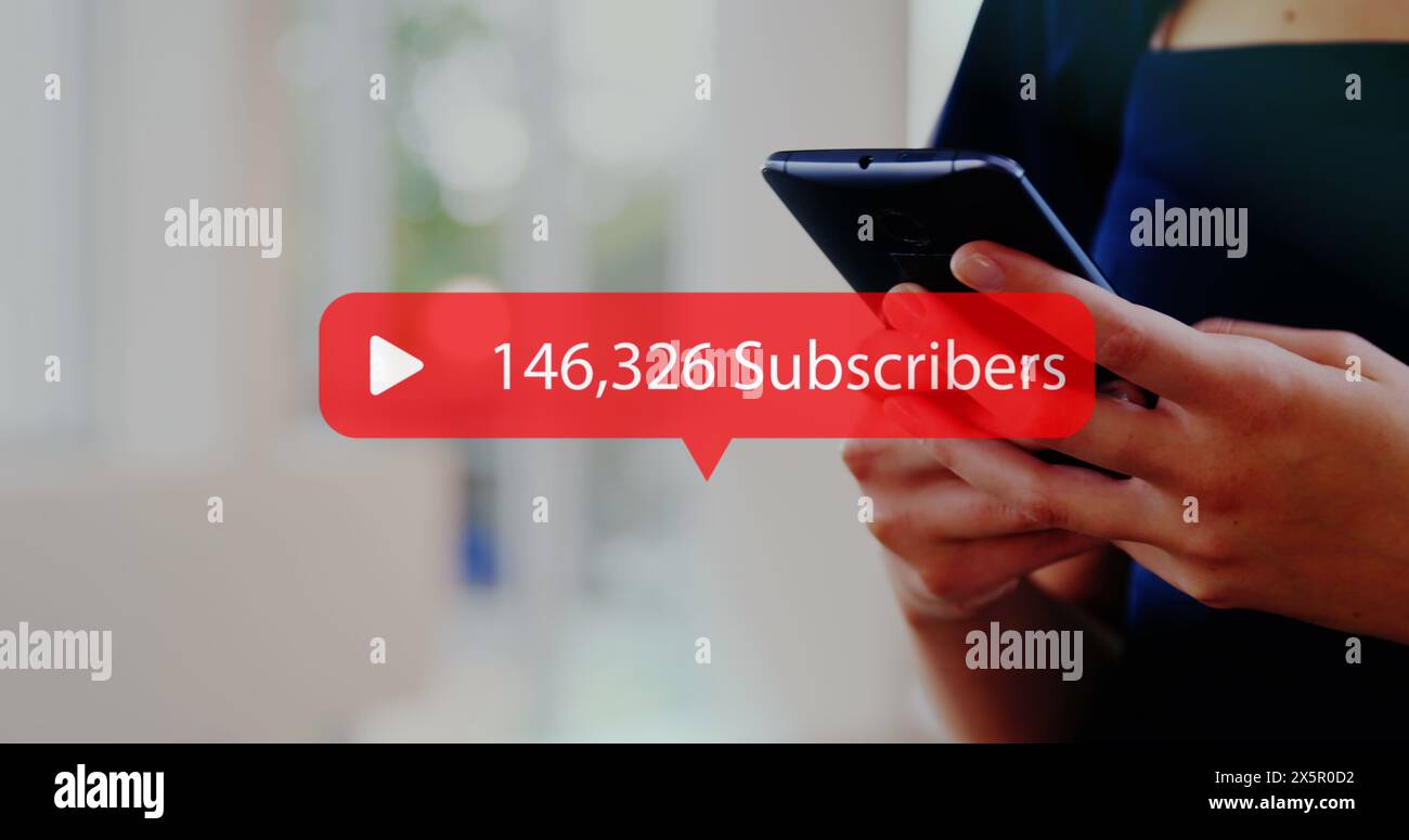 Caucasian woman holding smartphone, showing subscriber count Stock Photo - Alamy