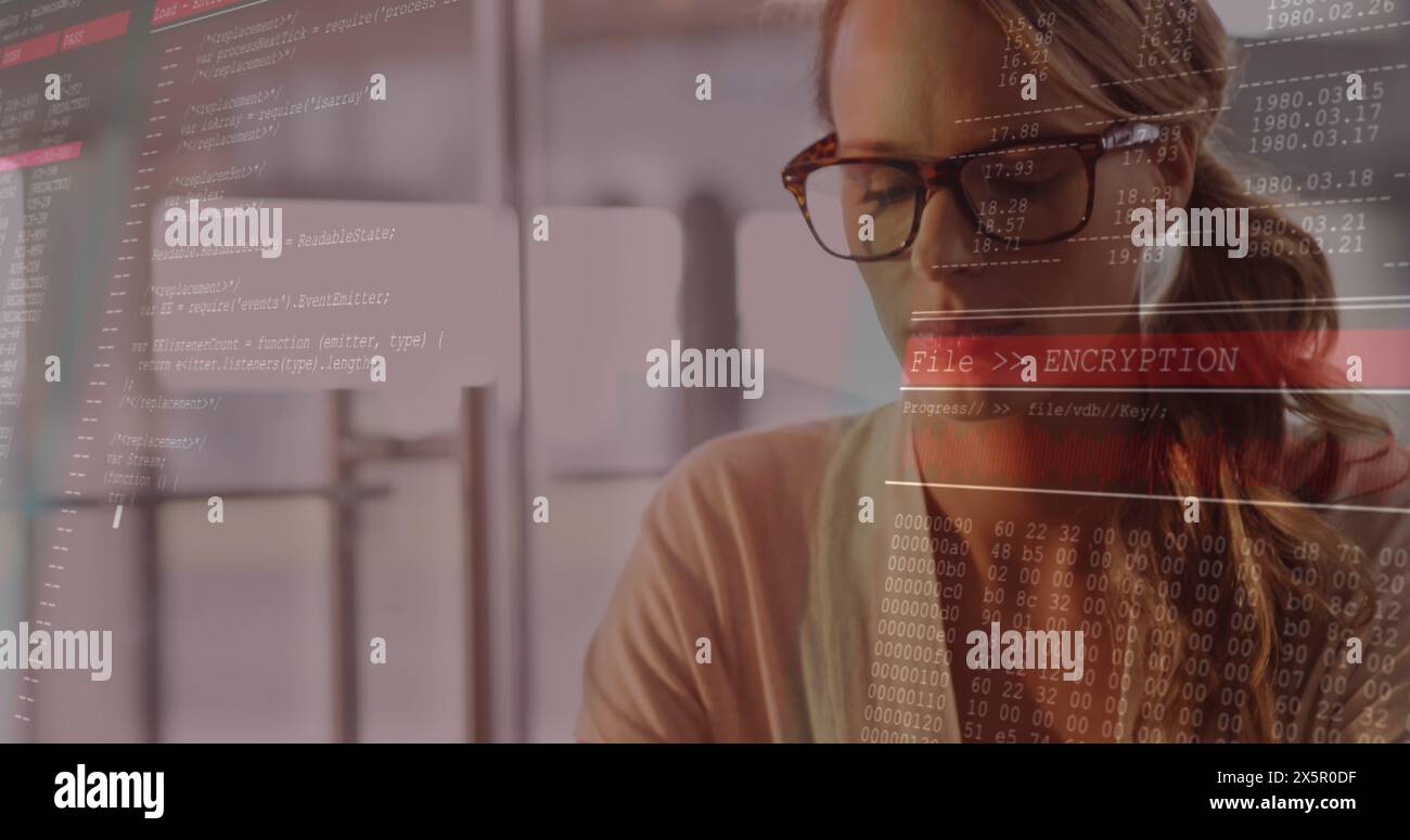 Caucasian female, wearing glasses, focusing on coding on computer Stock ...
