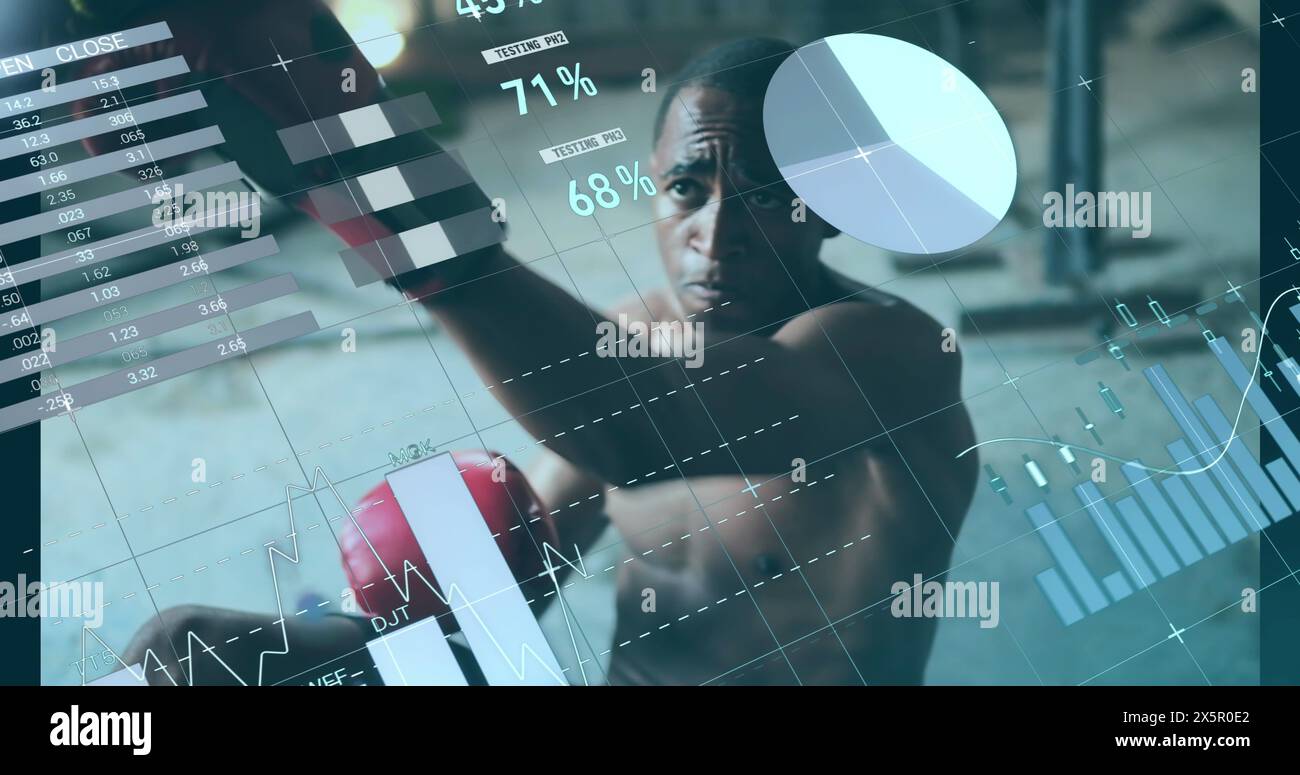 African American athlete training with boxing gloves, digital graphs ...