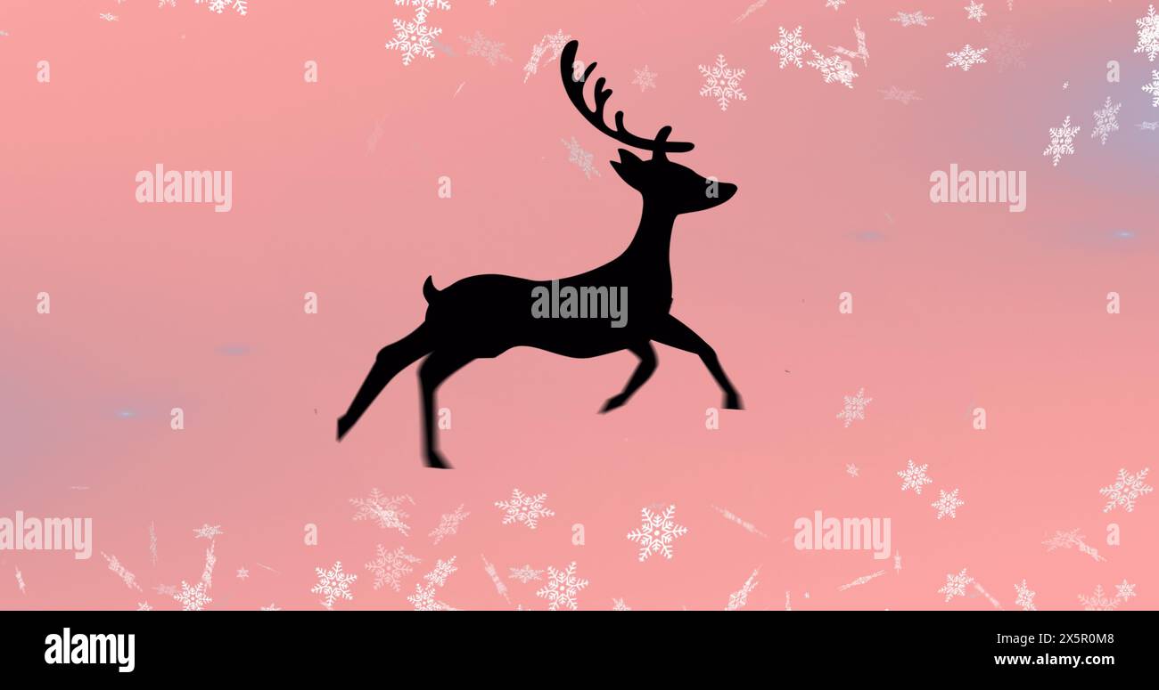 Image of reindeer over snow falling Stock Photo - Alamy