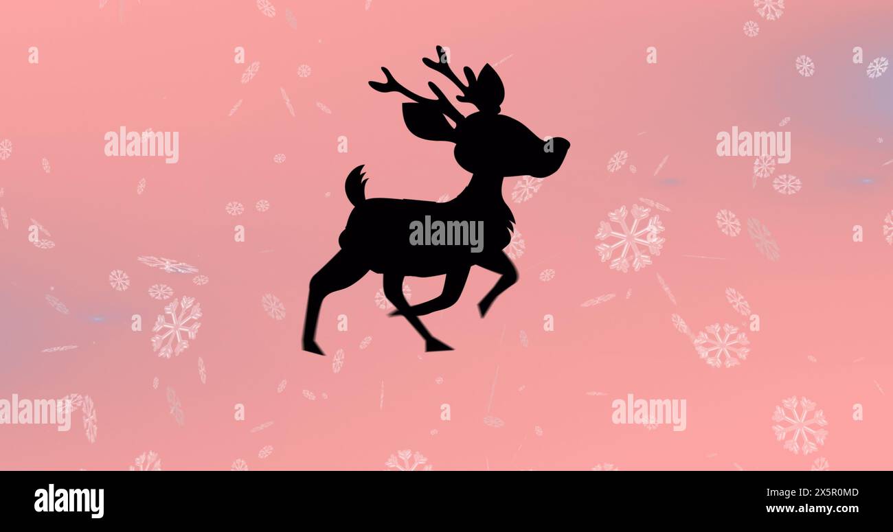 Image of reindeer over snow falling Stock Photo - Alamy