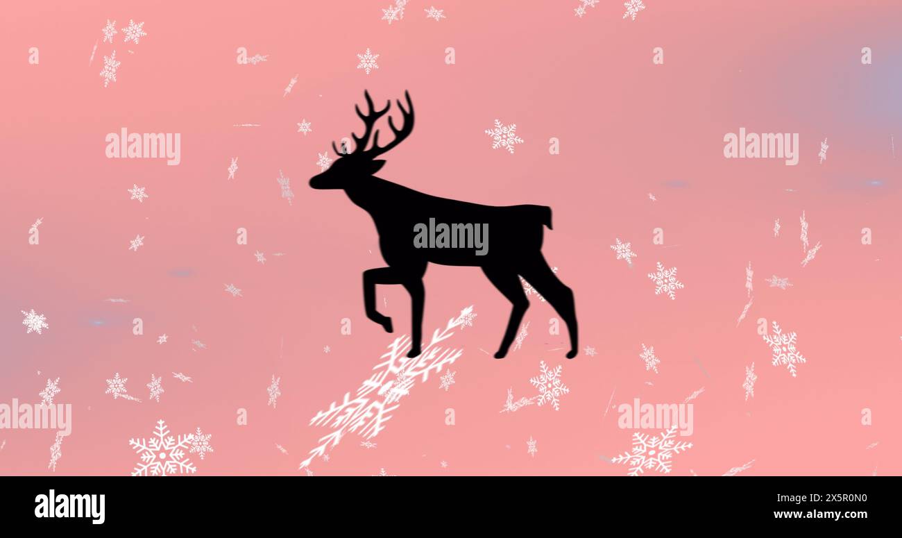 Image of reindeer over snow falling Stock Photo - Alamy