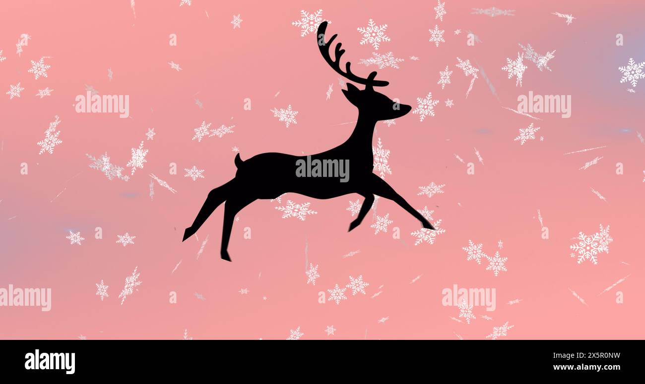 Image of reindeer over snow falling Stock Photo - Alamy