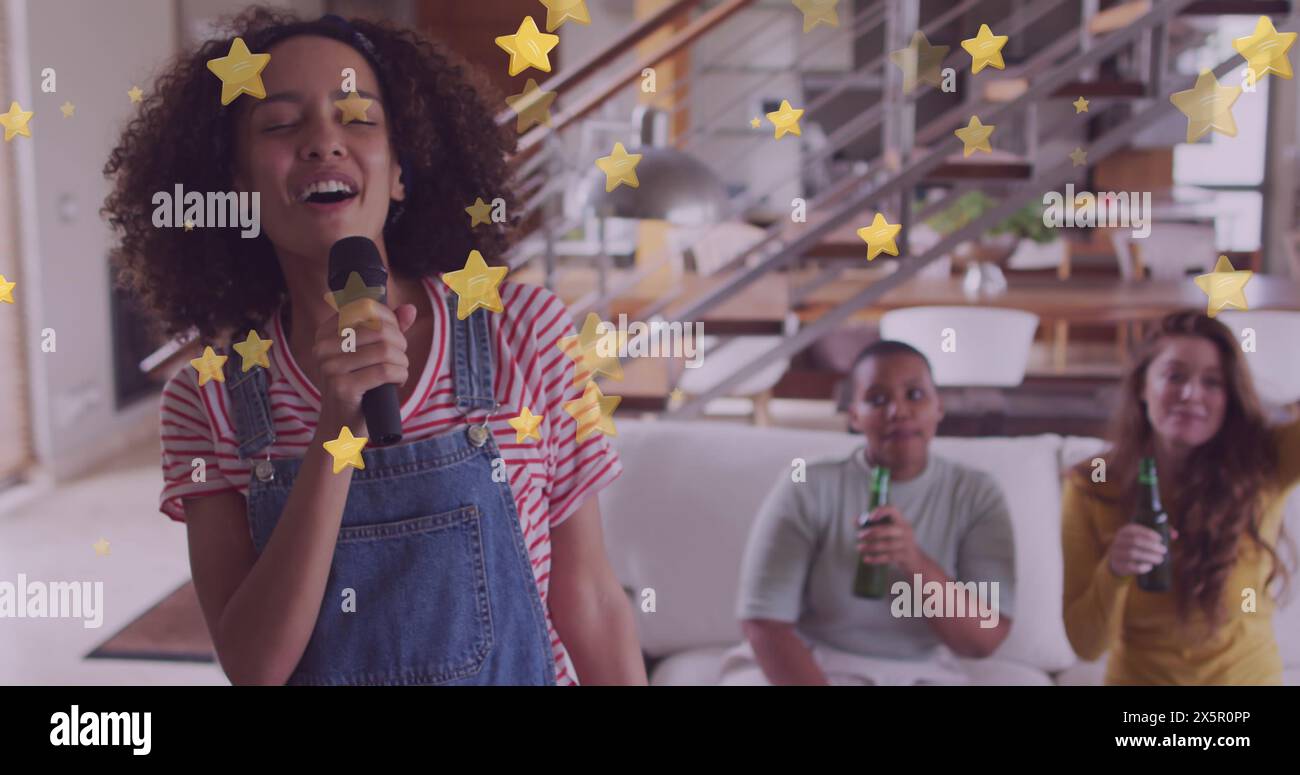 Biracial model singing, friends watching, enjoying drinks Stock Photo ...