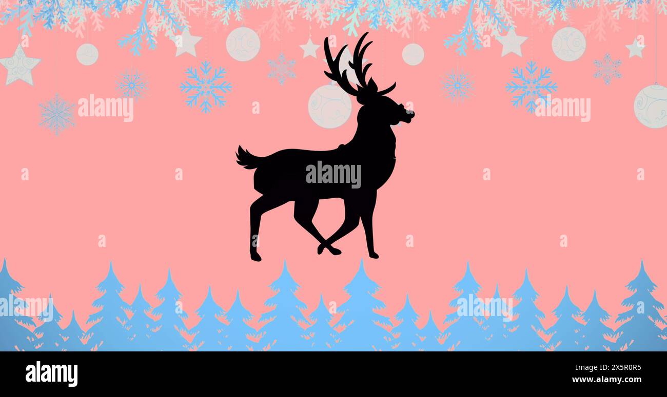 Image of reindeer over snow falling Stock Photo - Alamy