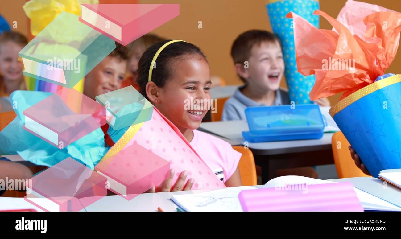 Image of books moving over happy school children in classroom Stock ...