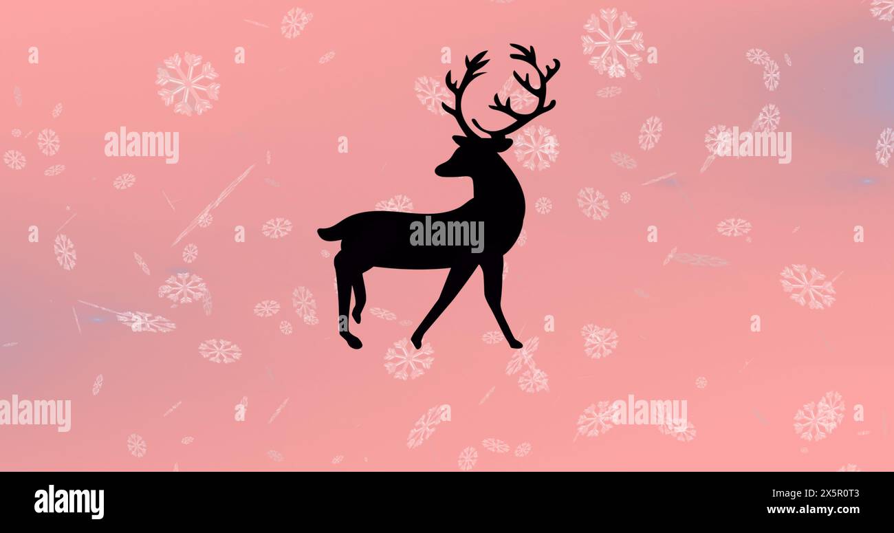Image of reindeer over snow falling Stock Photo - Alamy