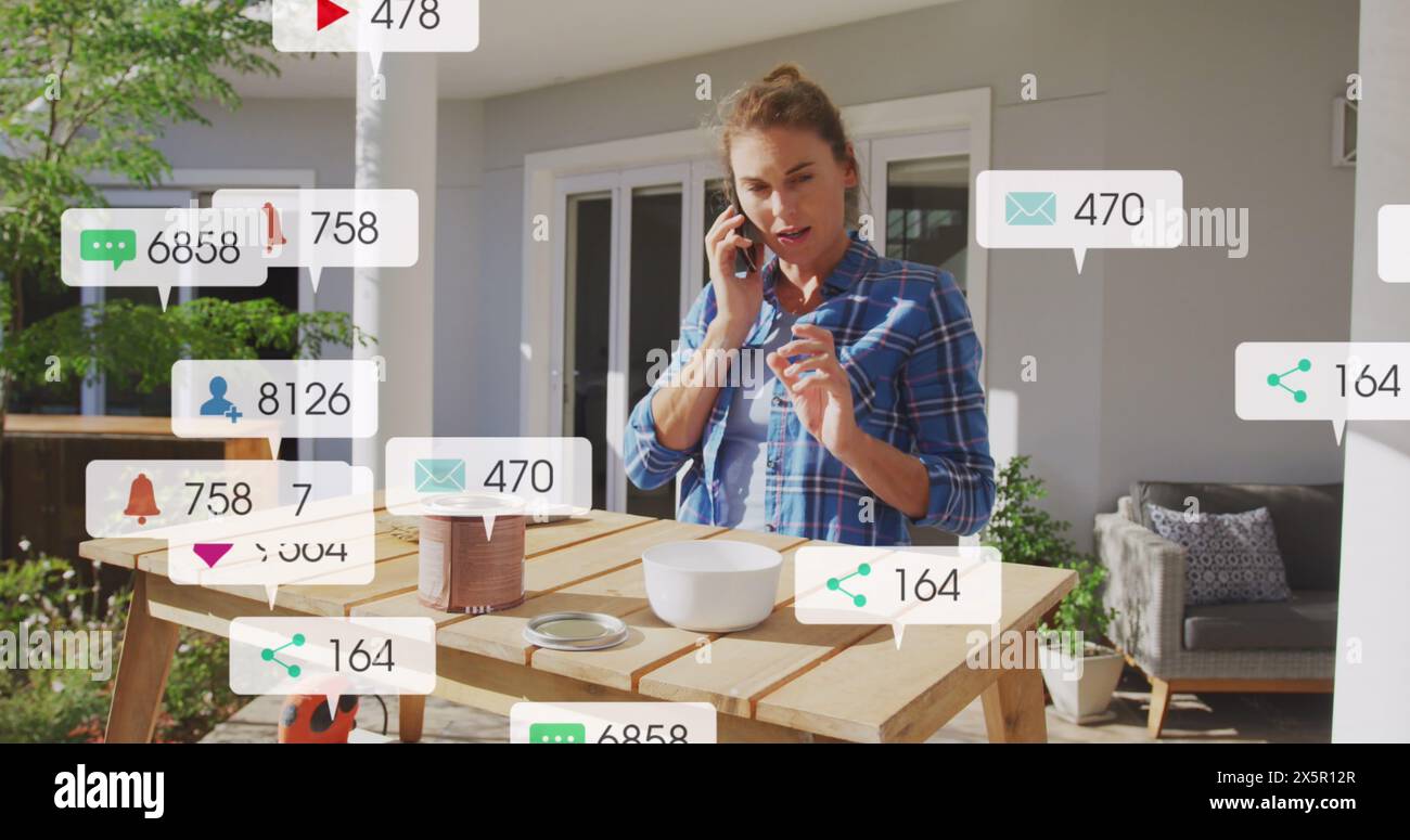 A woman is spending time in her garden and renovating her house while social distancing and self ...