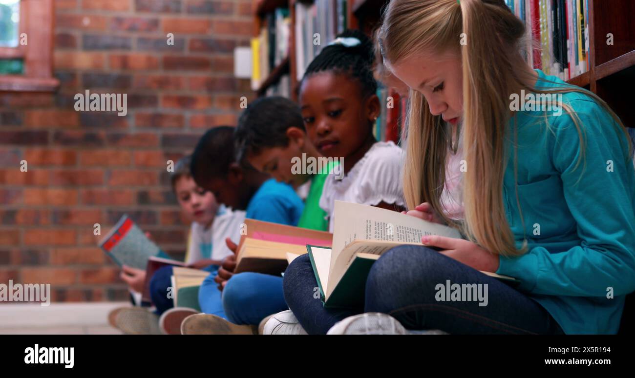 School library hosts diverse group of students, all reading books Stock ...