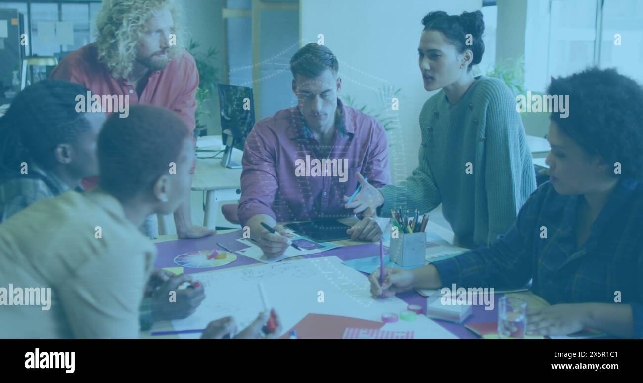 Diverse team of colleagues discussing business app design Stock Photo ...