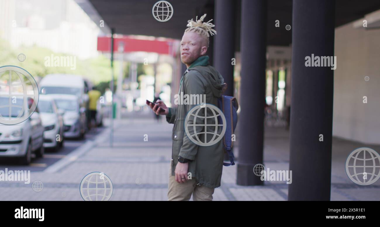 Image of globe icons over albino african american man walking while ...