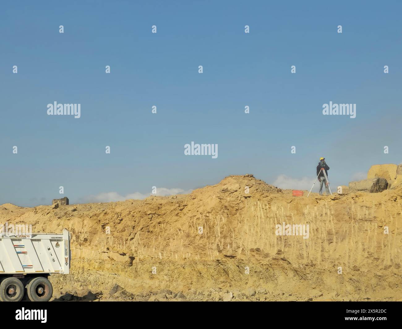 Cairo, Egypt, March 23 2024: An engineer and ground leveling with laser ...