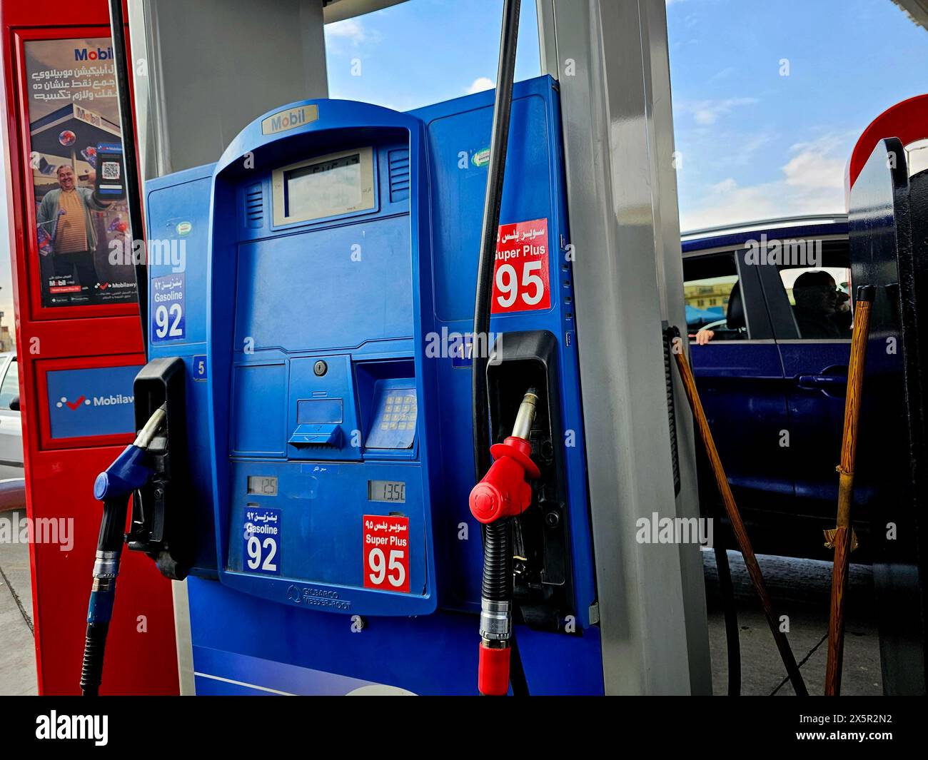 Cairo, Egypt, March 24 2024: gas service station with filling gun ...