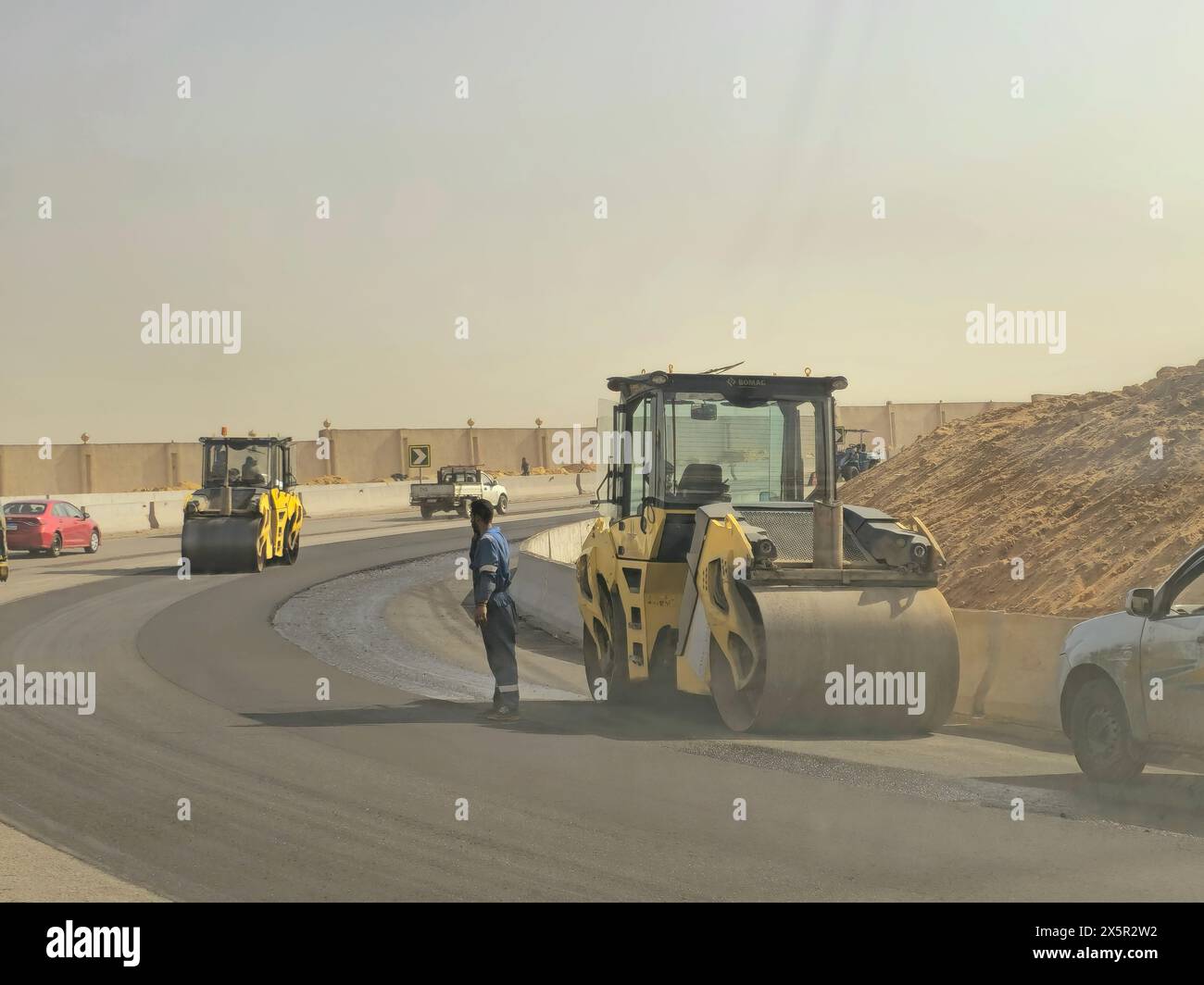 Cairo, Egypt, March 27 2024: process of paving a road and making ...