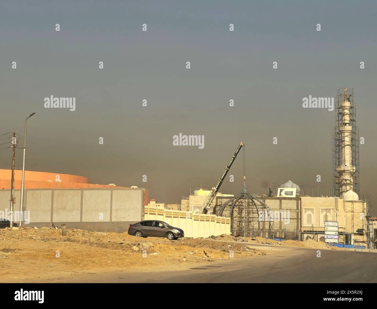 Cairo, Egypt, March 27 2024: A construction site of a new mosque with a ...