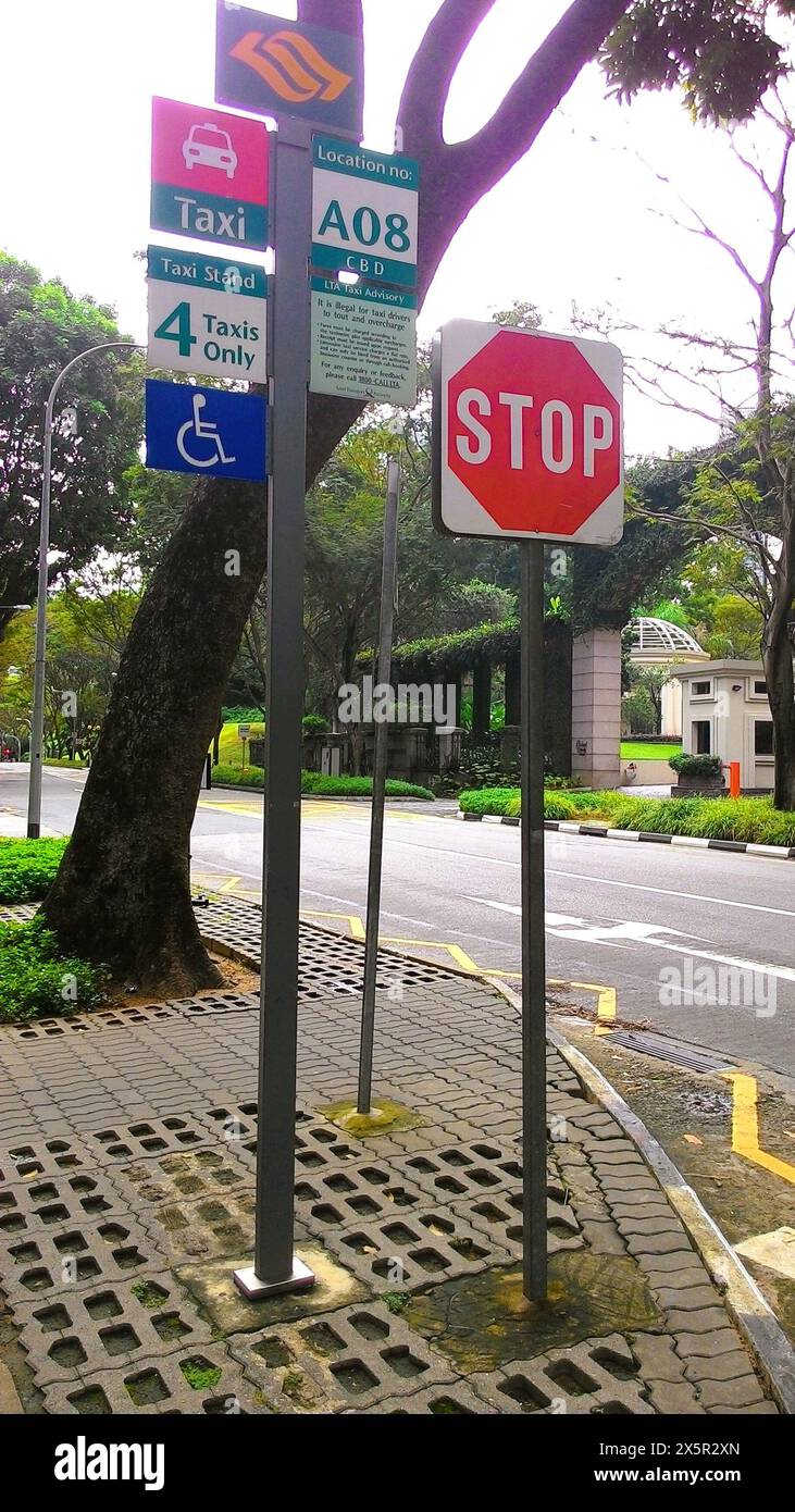 Red stop sign sitting on top of a metal pole Stock Photo - Alamy