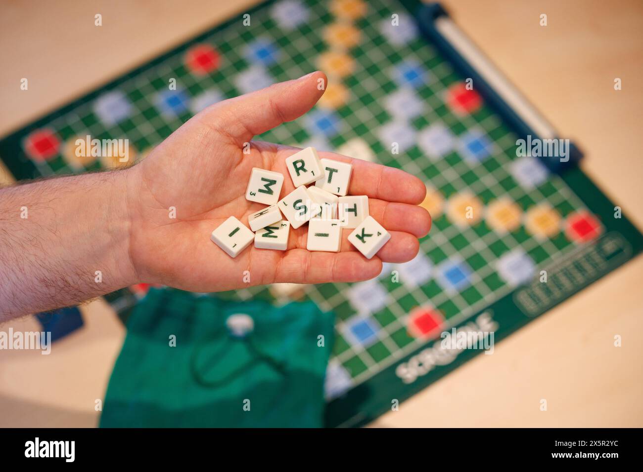 FILED - 10 May 2024, North Rhine-Westphalia, Minden: A Scrabble player ...