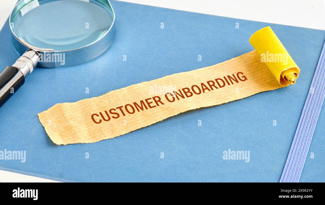 Concept Business. CUSTOMER ONBOARDING symbol on a note made of paper on ...