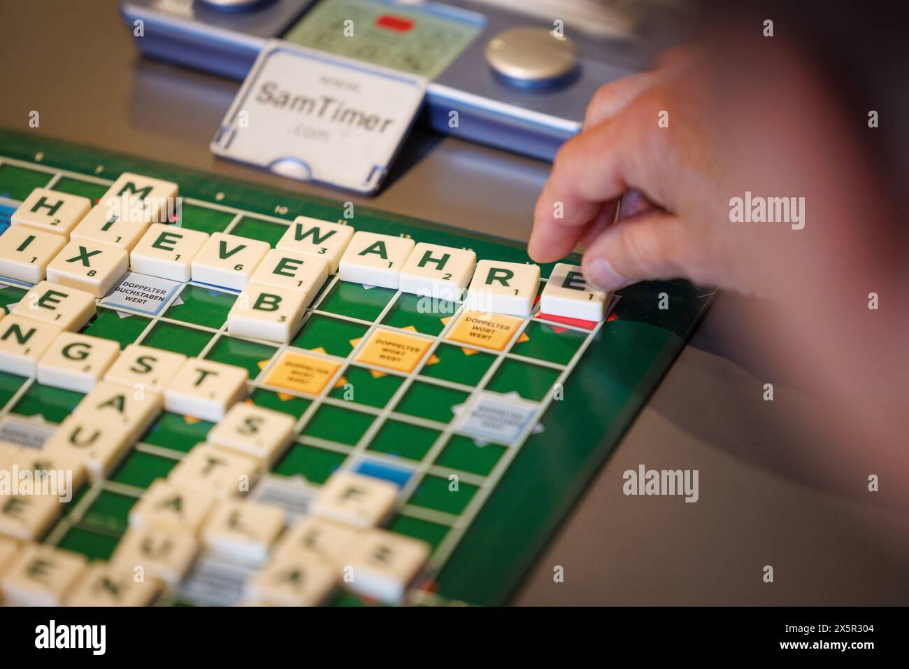 Minden, Germany. 10th May, 2024. A Scrabble player sits at a table at ...
