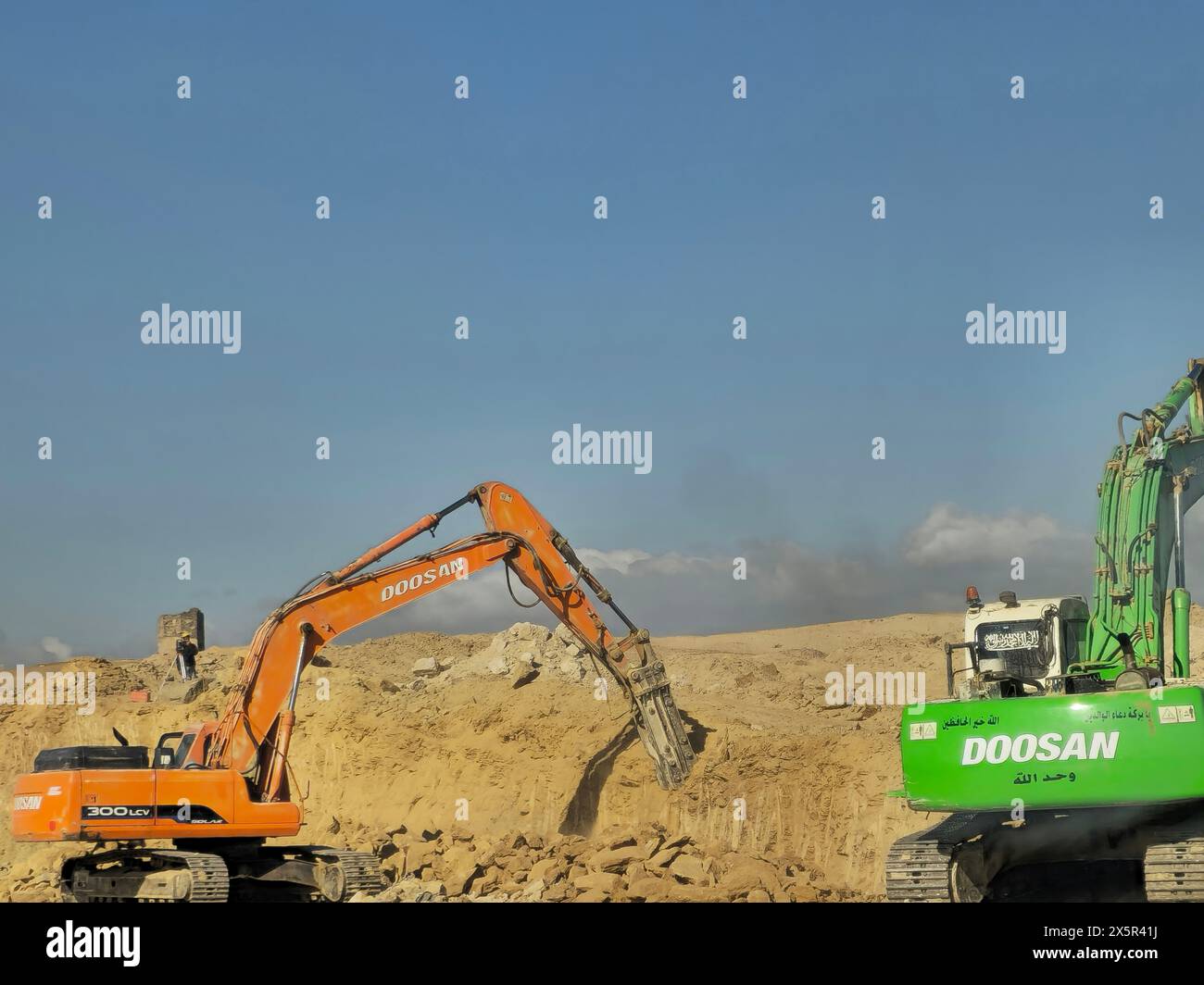 Cairo, Egypt, March 23 2024: demolition hydraulic crawler excavators ...