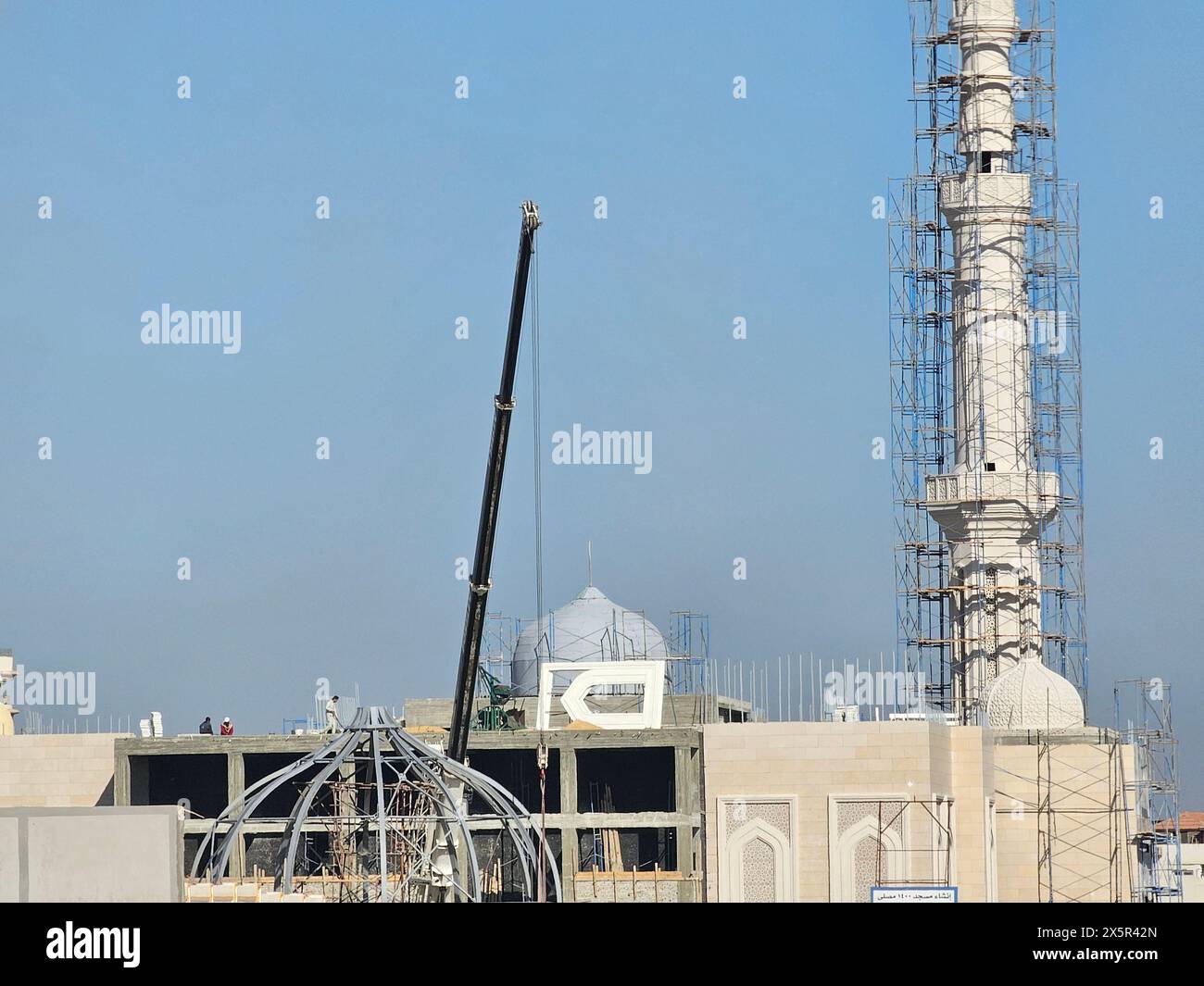 Cairo, Egypt, March 23 2024: A construction site of a new mosque with a ...