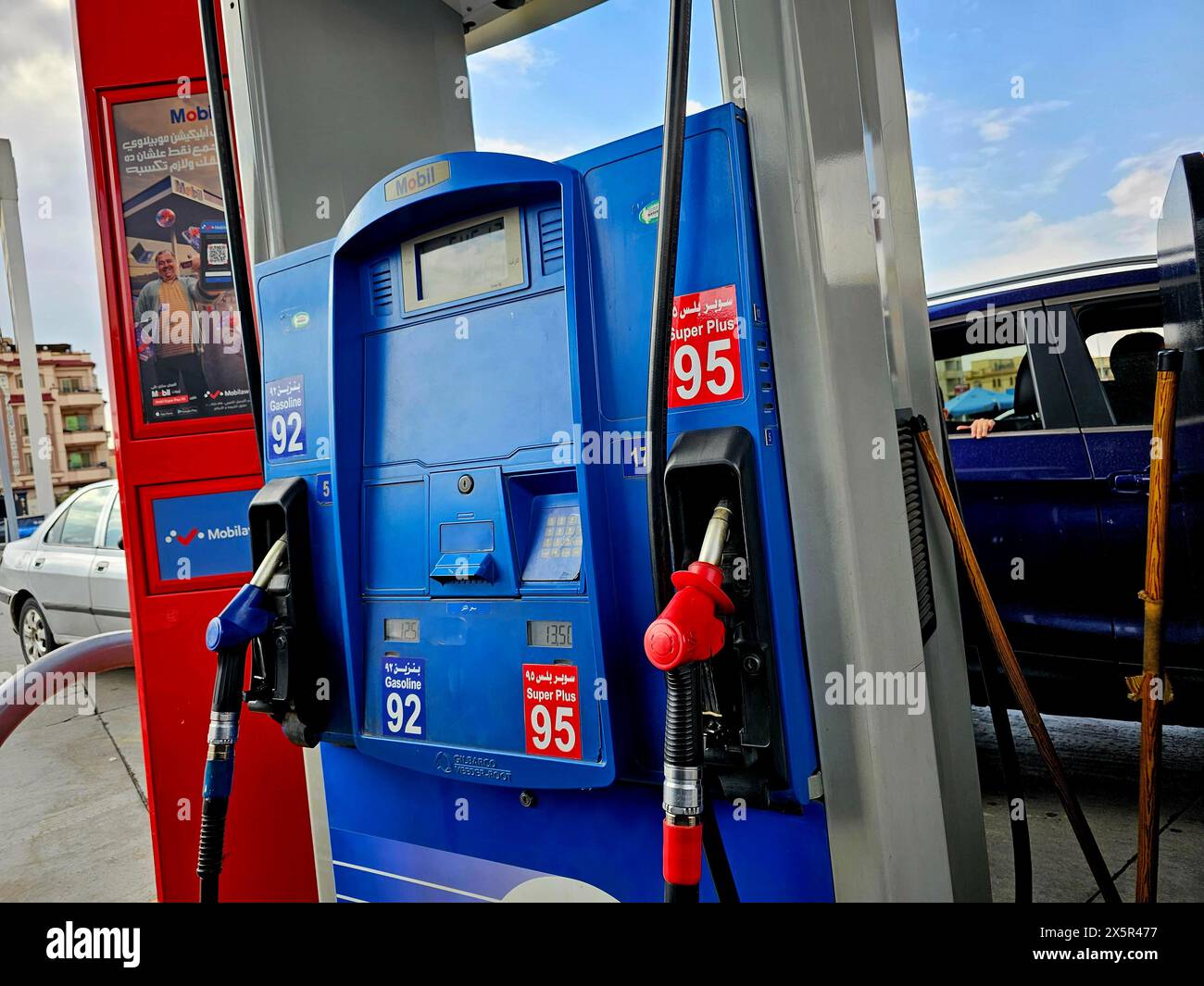 Cairo, Egypt, March 24 2024: gas service station with filling gun ...