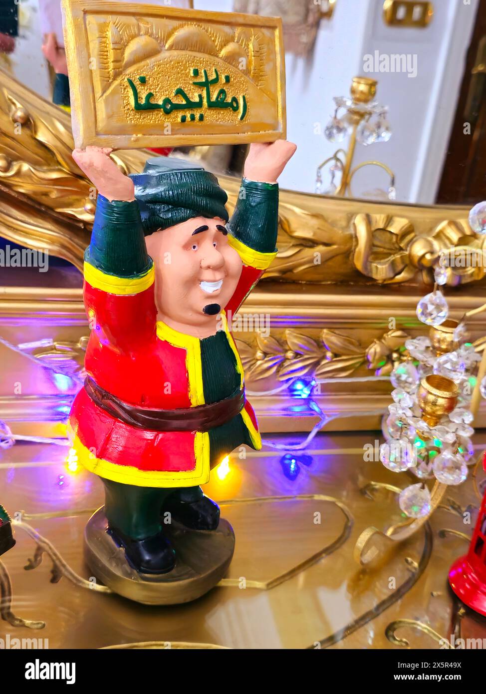 Giza, Egypt, March 26 2024: Fananes character with an Arabic sign with ...