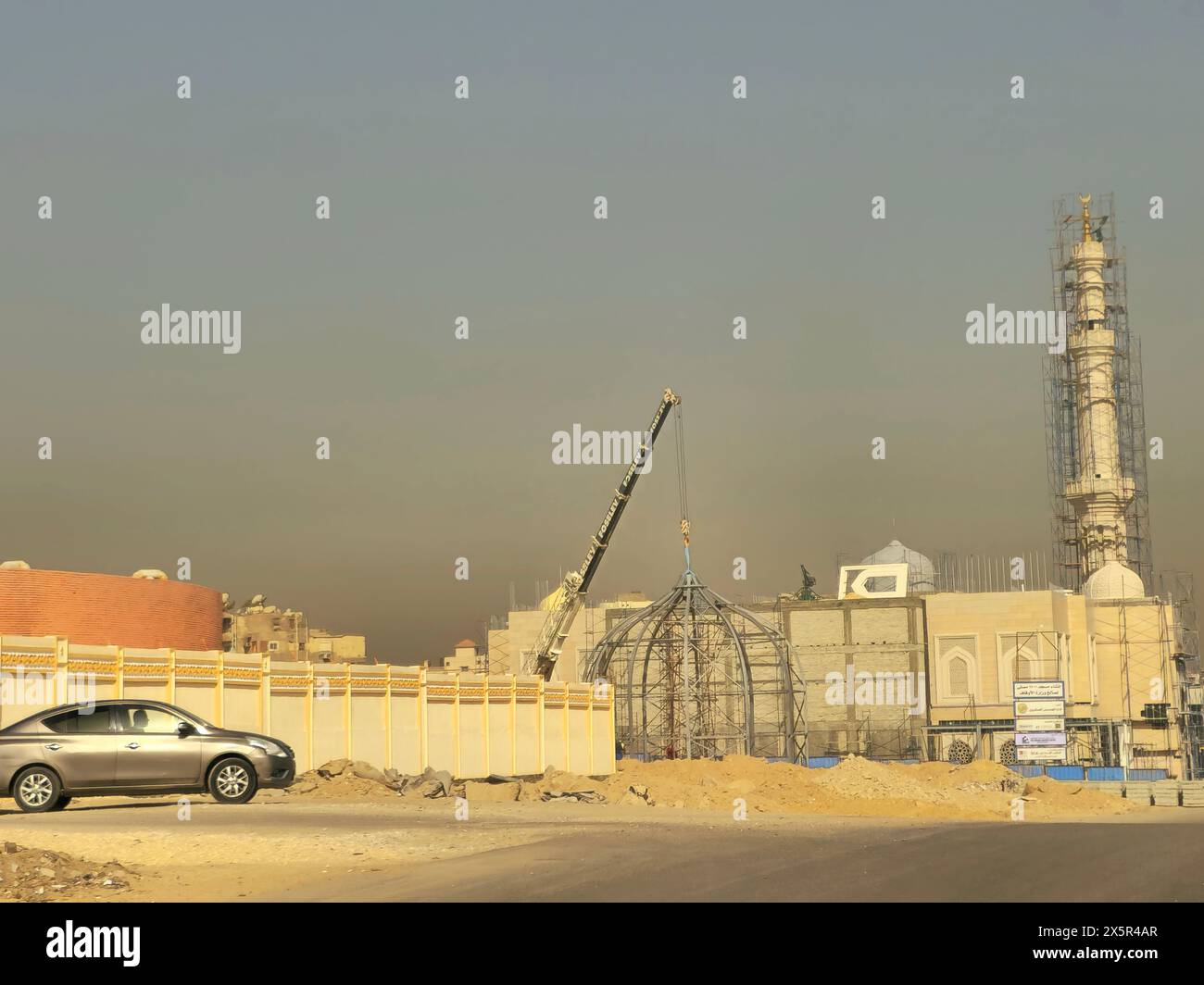 Cairo, Egypt, March 27 2024: A construction site of a new mosque with a ...